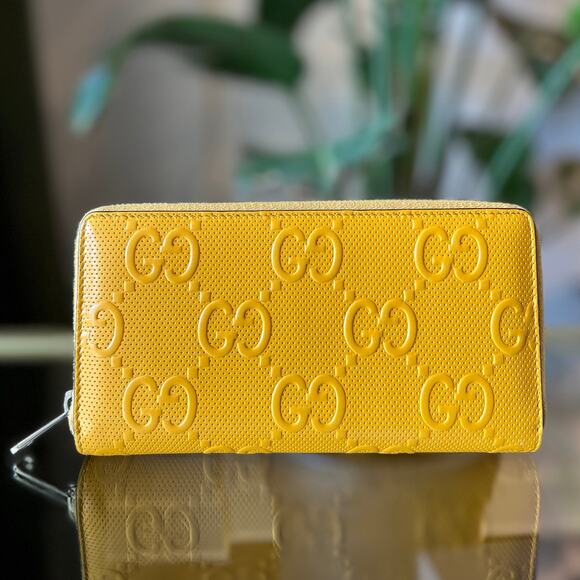 Gucci | Bags | Gucci Gg Yellow Embossed Leather Zip Around Wallet ...